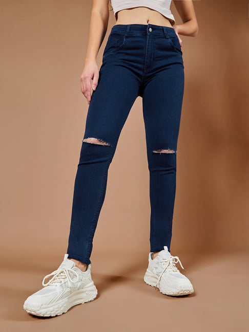 Distressed dark blue jeans store
